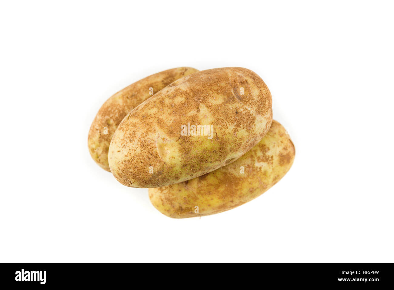 Three potatoes isolated on a white background Stock Photo - Alamy