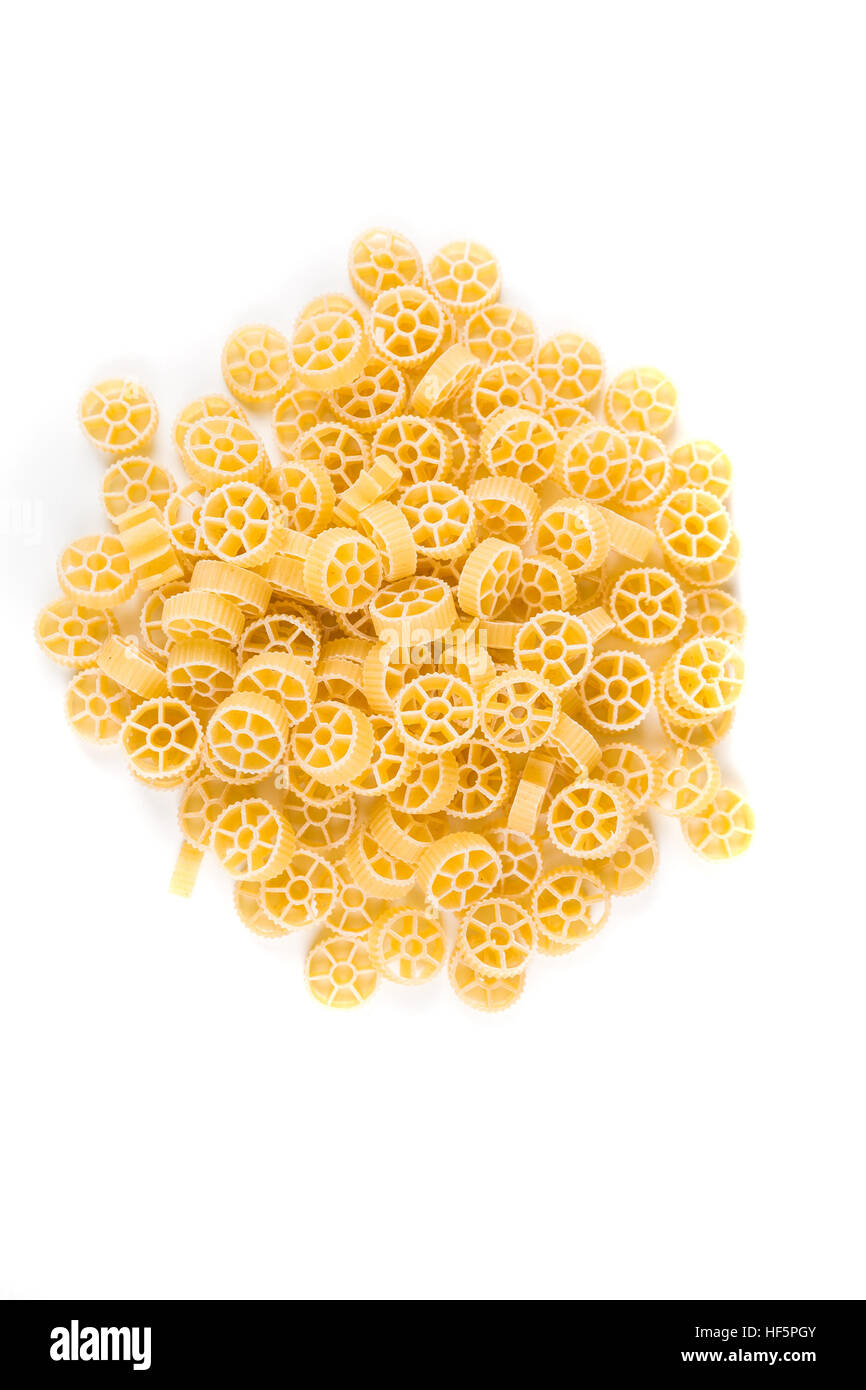 Wheat wagon wheel pasta isolated on a white background Stock Photo - Alamy