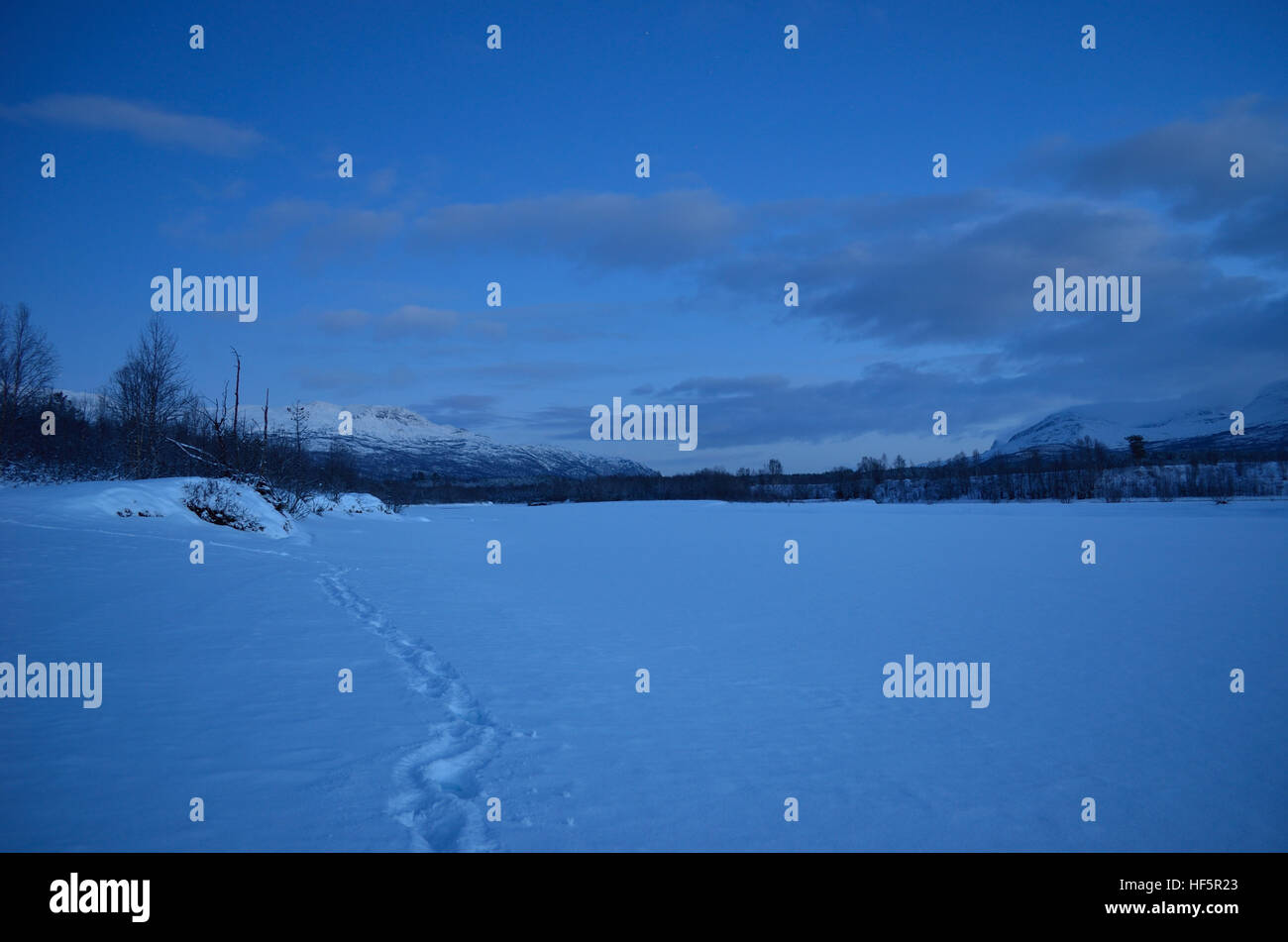 beautiful frozen river and mountain landscape in the high north winter ...