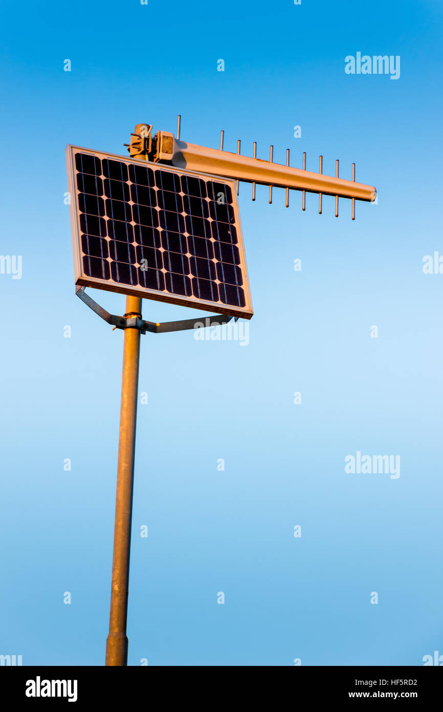 Log antenna transmitter powered by solar panel Stock Photo - Alamy