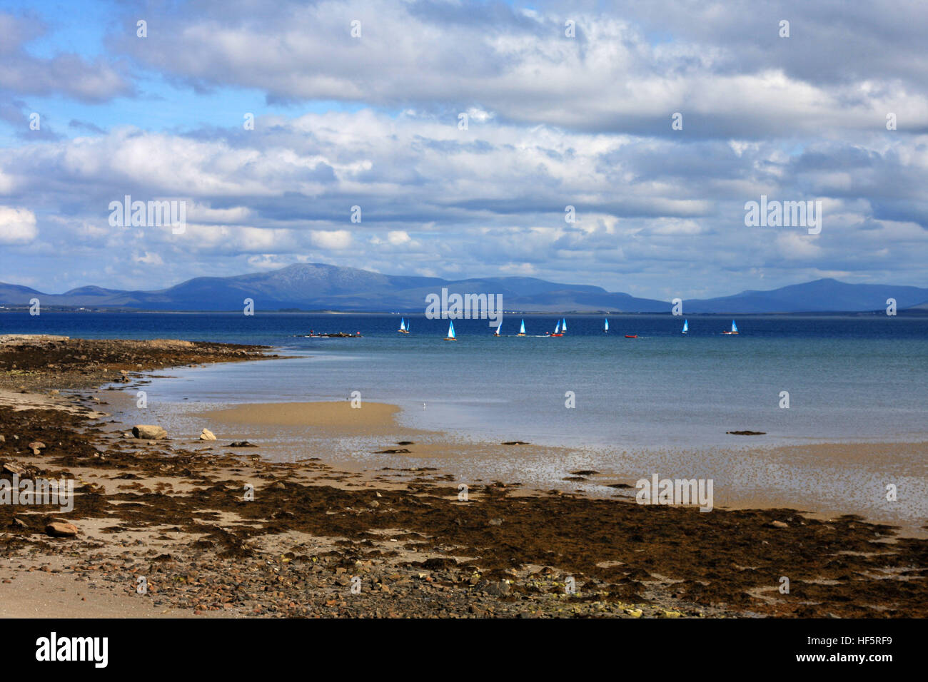 Mountains beach seaweed sailing boats County Mayo sails blue Stock ...
