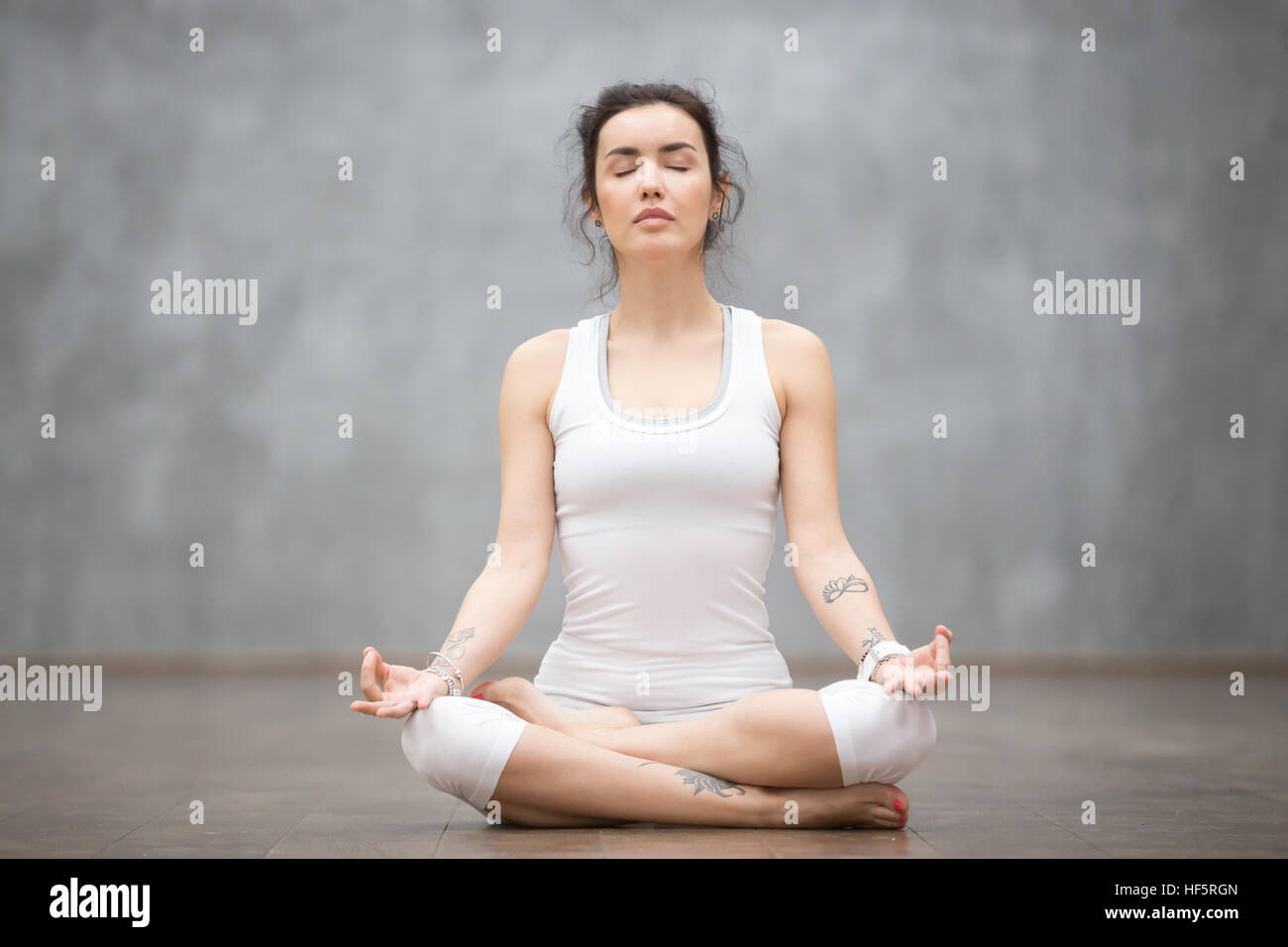 Beautiful Yoga: Half Lotus pose Stock Photo - Alamy