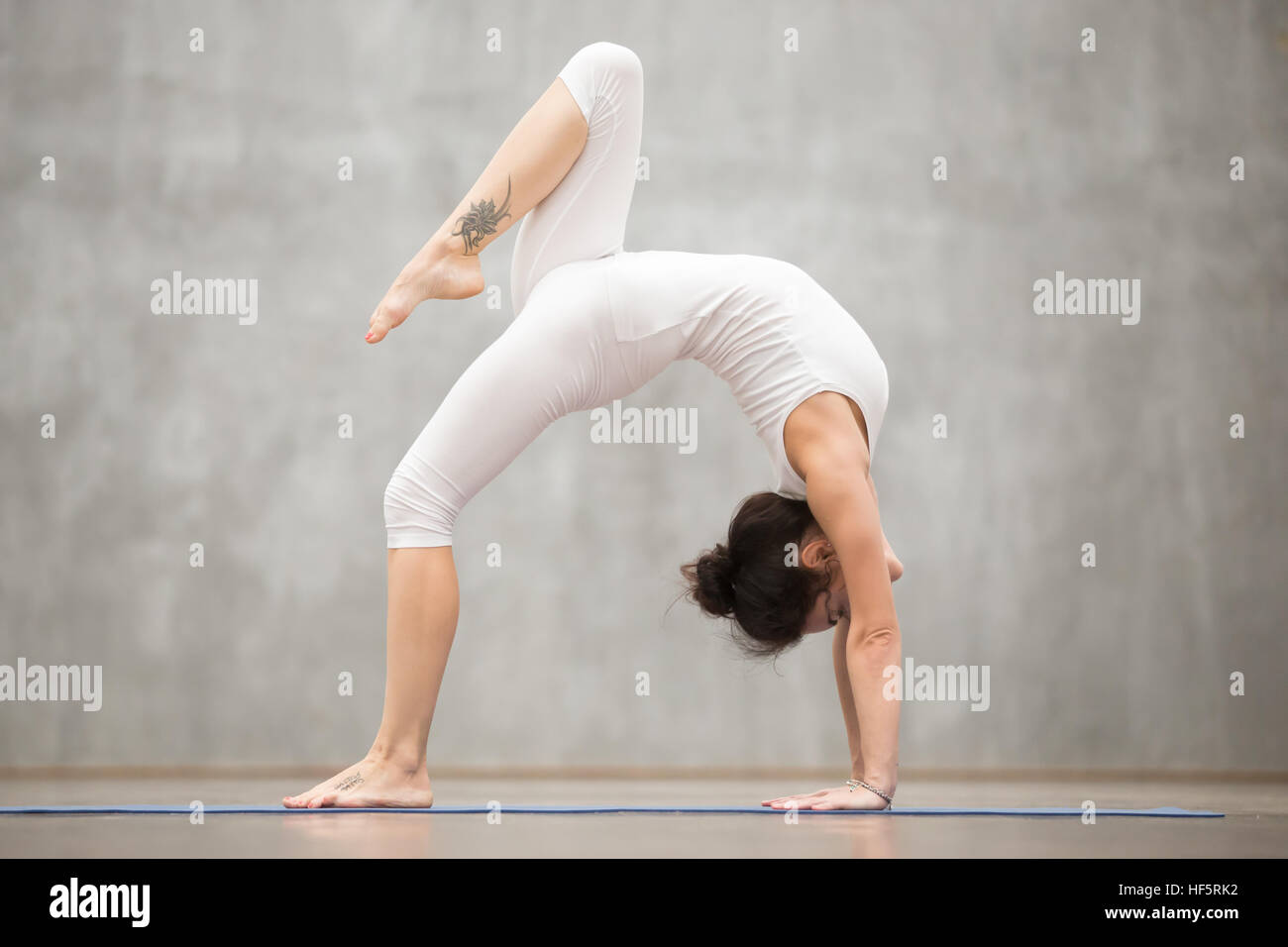 Beautiful Yoga: One legged Wheel pose Stock Photo - Alamy