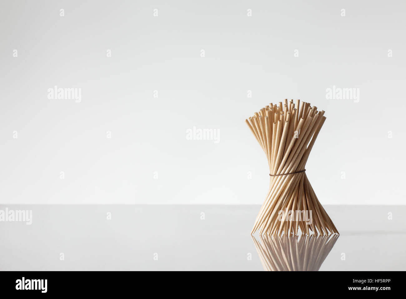 cocktail sticks wrapped up standing on white background Stock Photo - Alamy