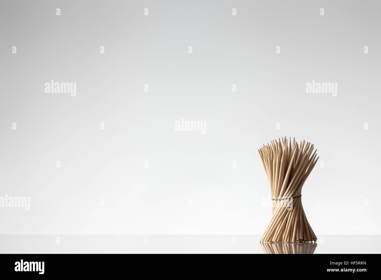 cocktail sticks wrapped up standing on white background Stock Photo - Alamy