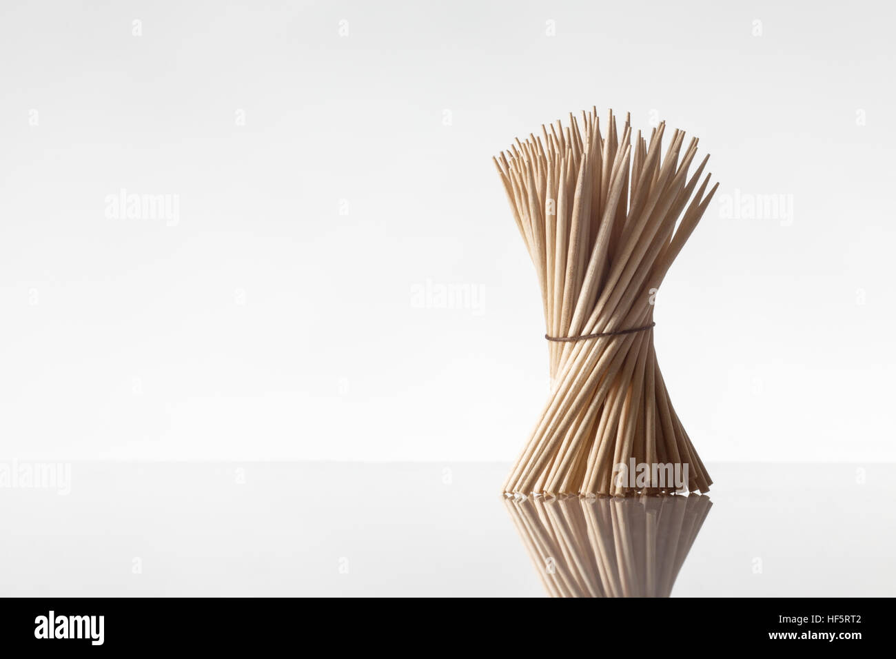 cocktail sticks wrapped up standing on white background Stock Photo - Alamy