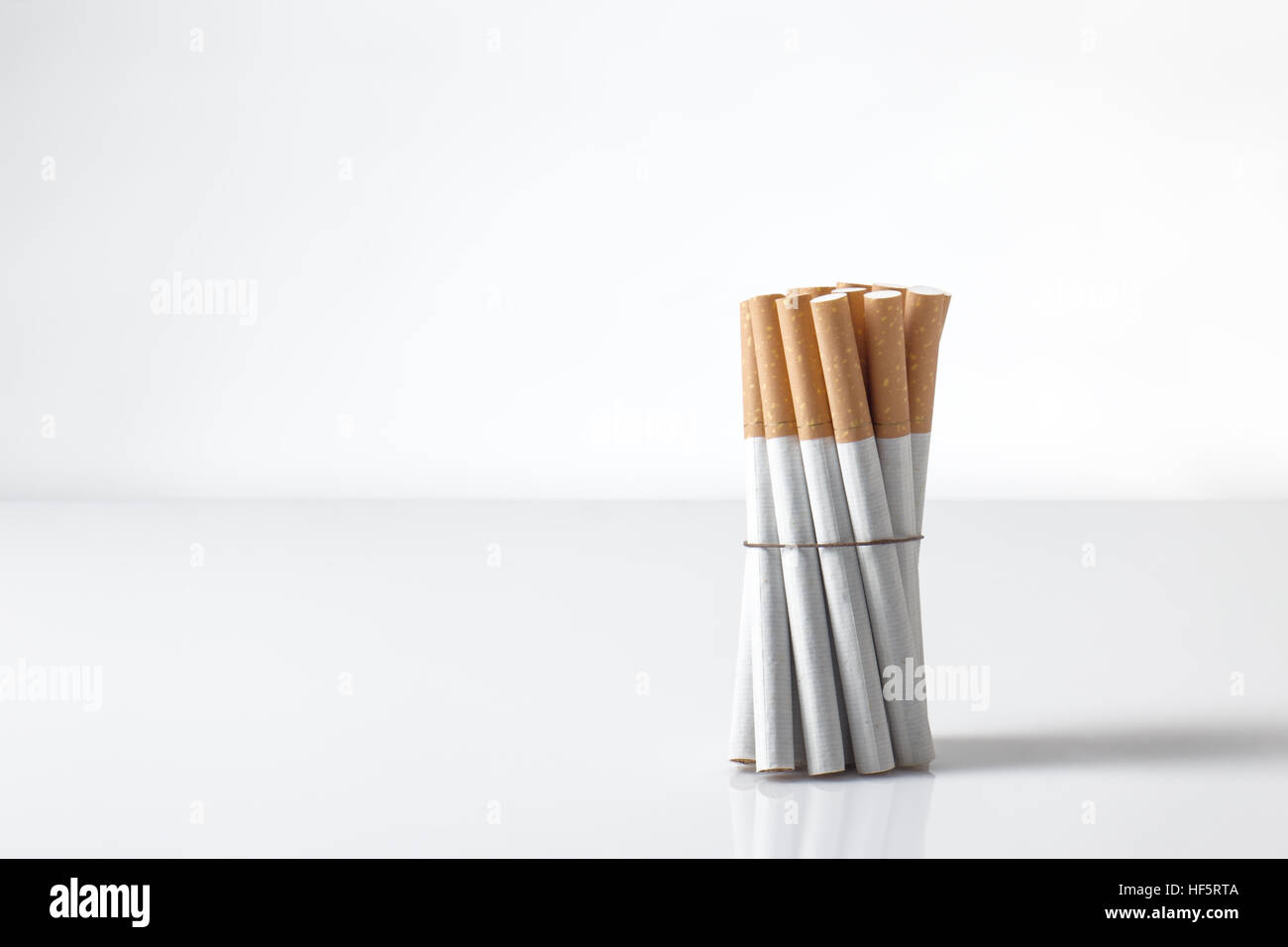 group of cigarettes wrapped up standing on white background Stock Photo ...