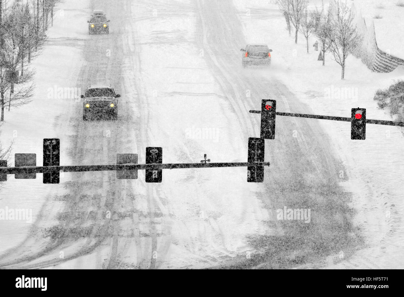 Driving on snow and snowy roads in winter traffic lights blizzard Stock ...