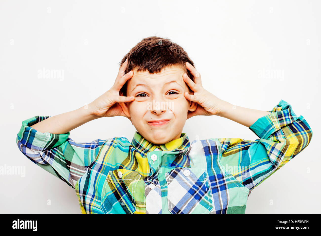 young pretty little boy kid wondering, posing emotional face isolated ...