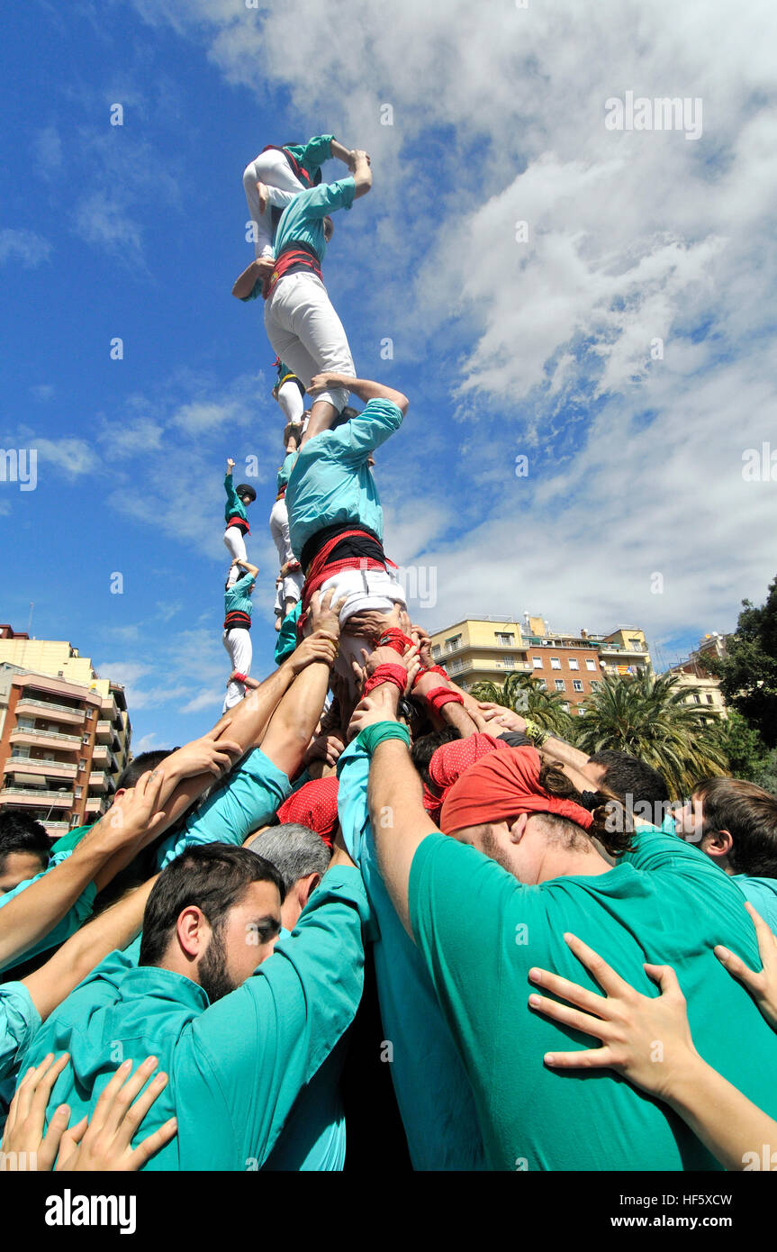 Castellers, human traditional tower next to the Sagrada Familia temple ...