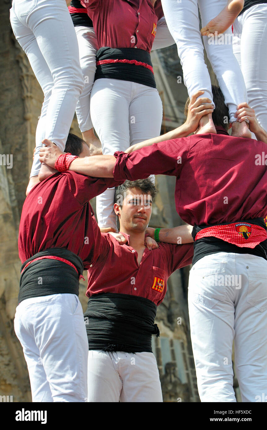 Castellers, human traditional tower next to the Sagrada Familia temple ...