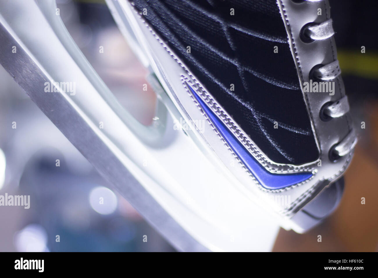 Ice skates in skate store shop window on display on sale for skating on ...