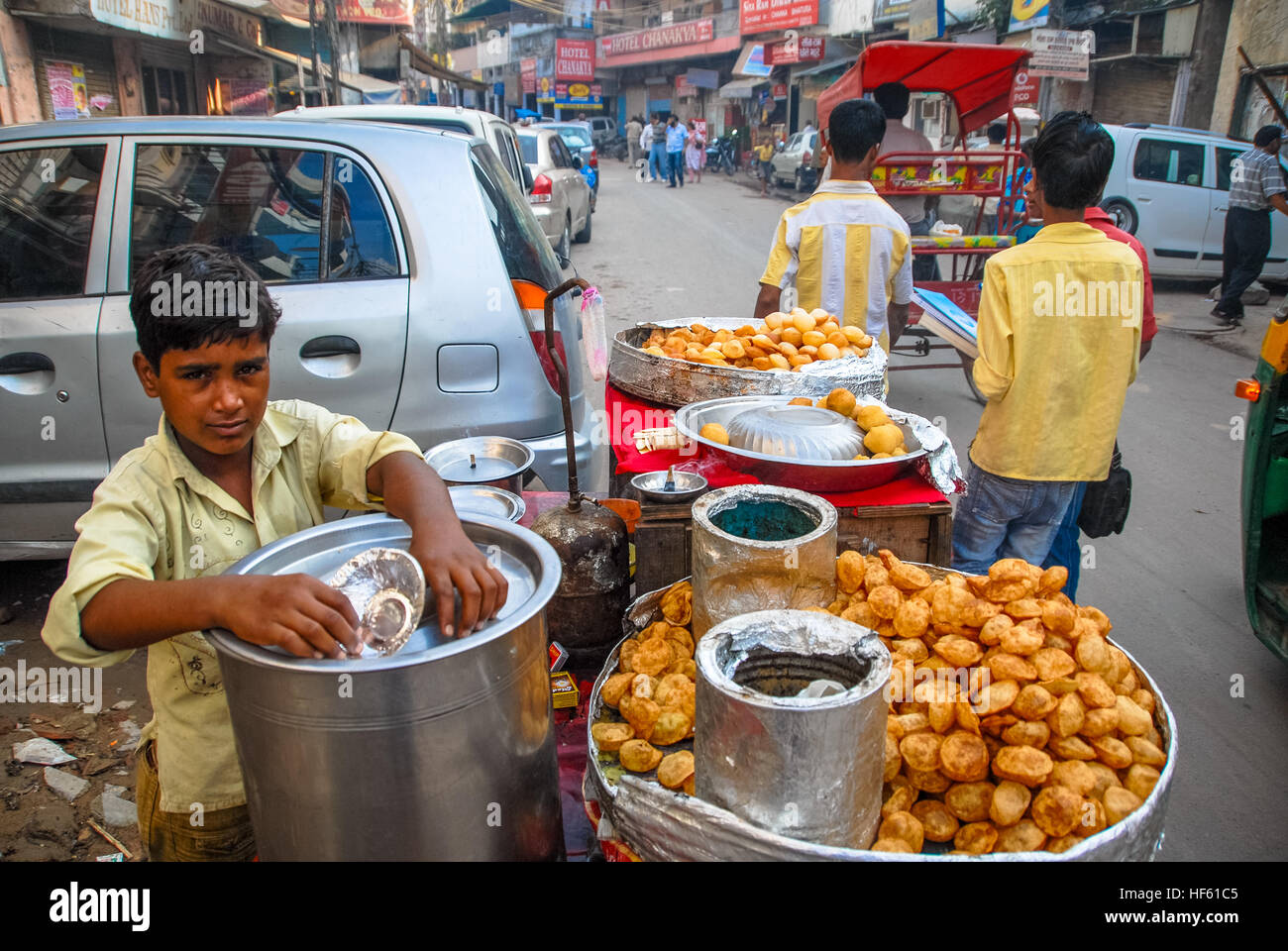 boy selling cookies from cart at street in Delhi, India Stock Photo - Alamy