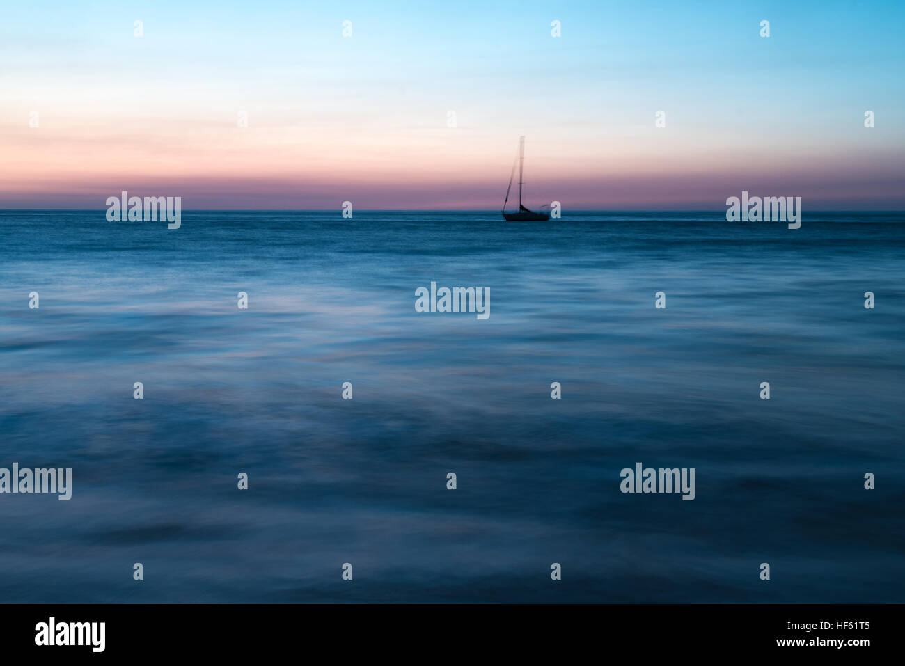 A lone ship in an ocean Stock Photo - Alamy