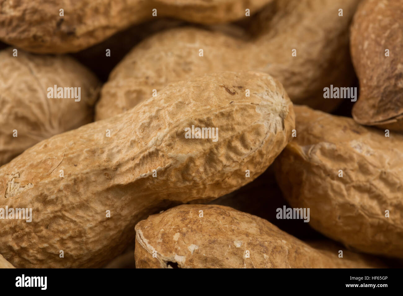 Pile of peanuts shells close up for background Stock Photo - Alamy