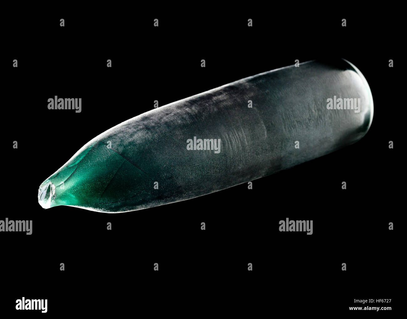 Synthetic sapphire boule produced by the Verneuil process on black ...