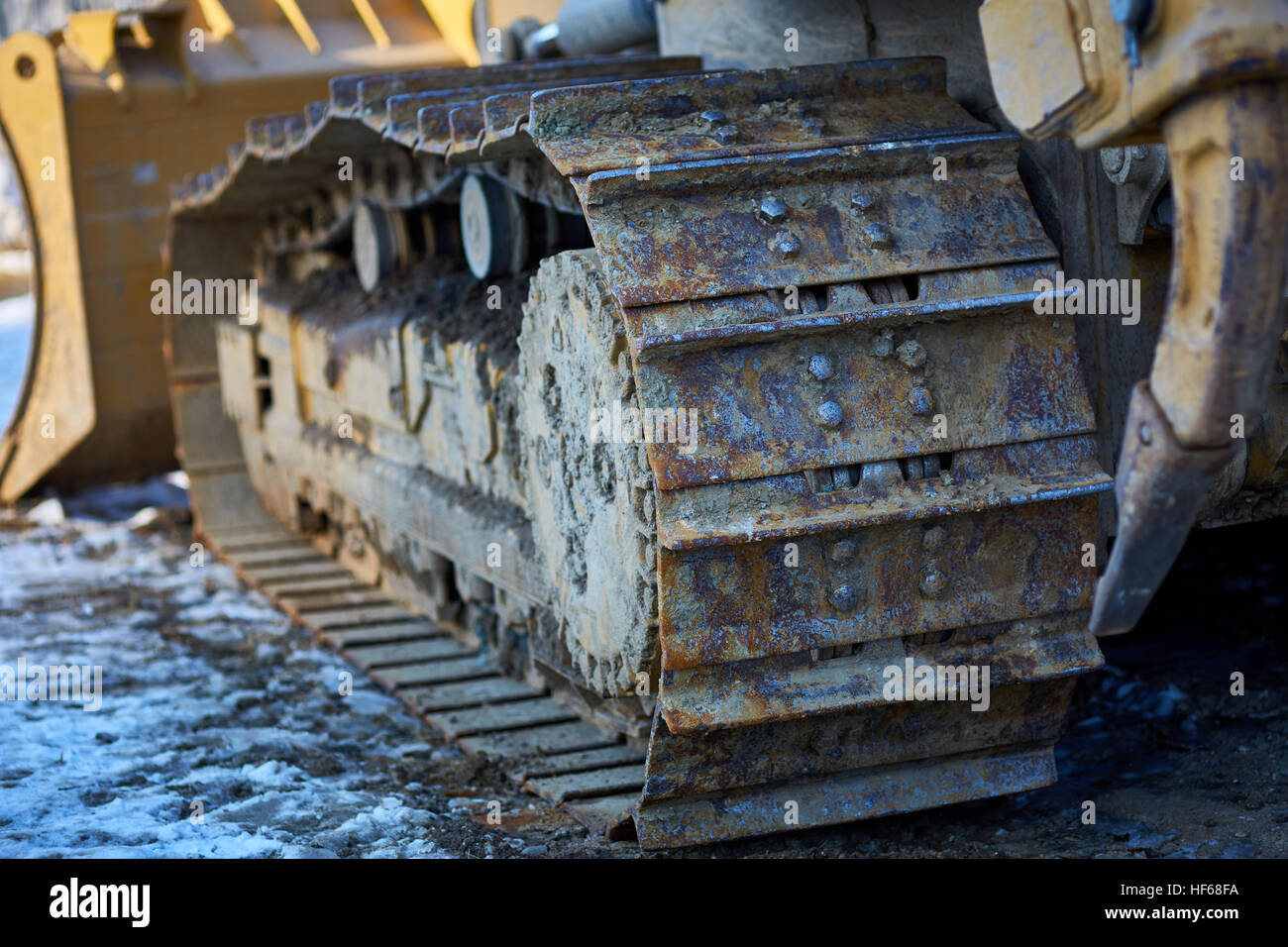 Closeup of rusty bulldozer tracks in the winter Stock Photo - Alamy