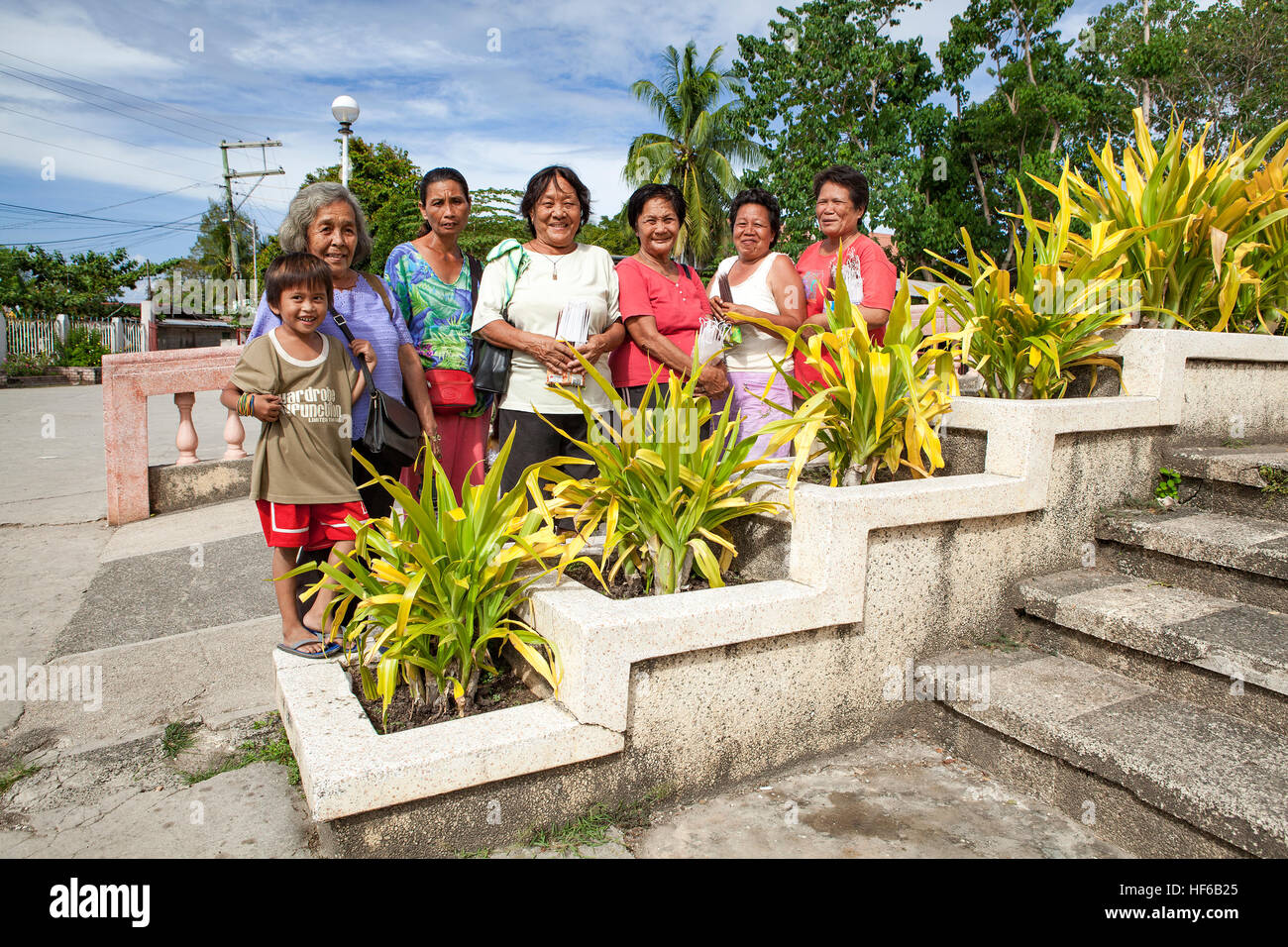Portrait of Catholic Christian Filipino women who sell votive candles ...