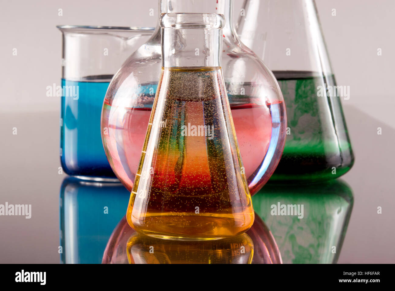 Chemistry abstract of colorful chemicals and glassware Stock Photo - Alamy
