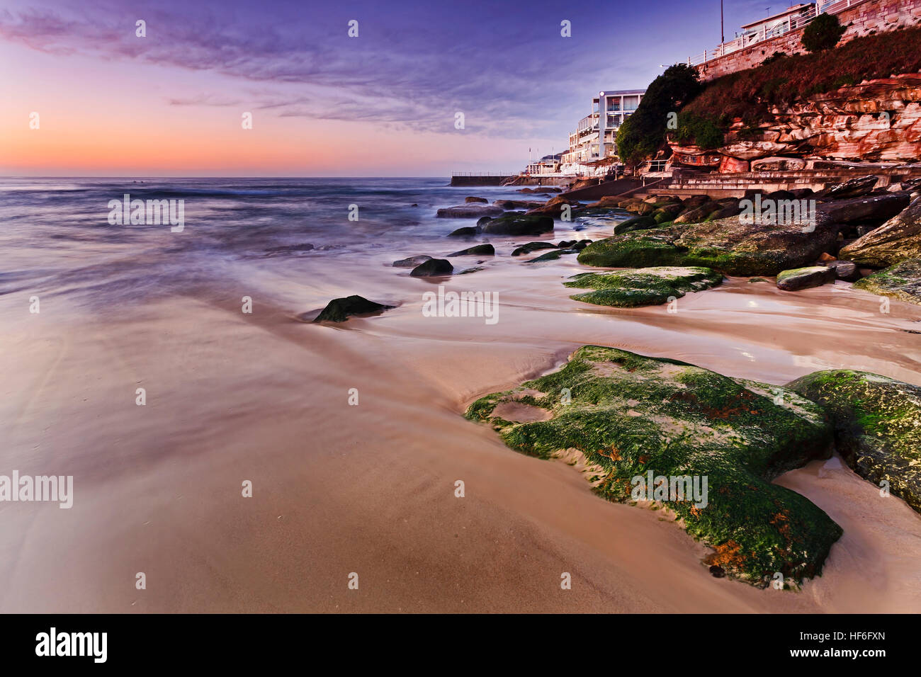 Clean Bondi beach sand at low tide with open alga covered seabed ...