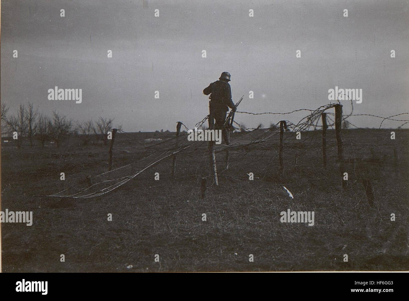 A World War I-era photograph showing soldiers overcoming obstacles, as ...