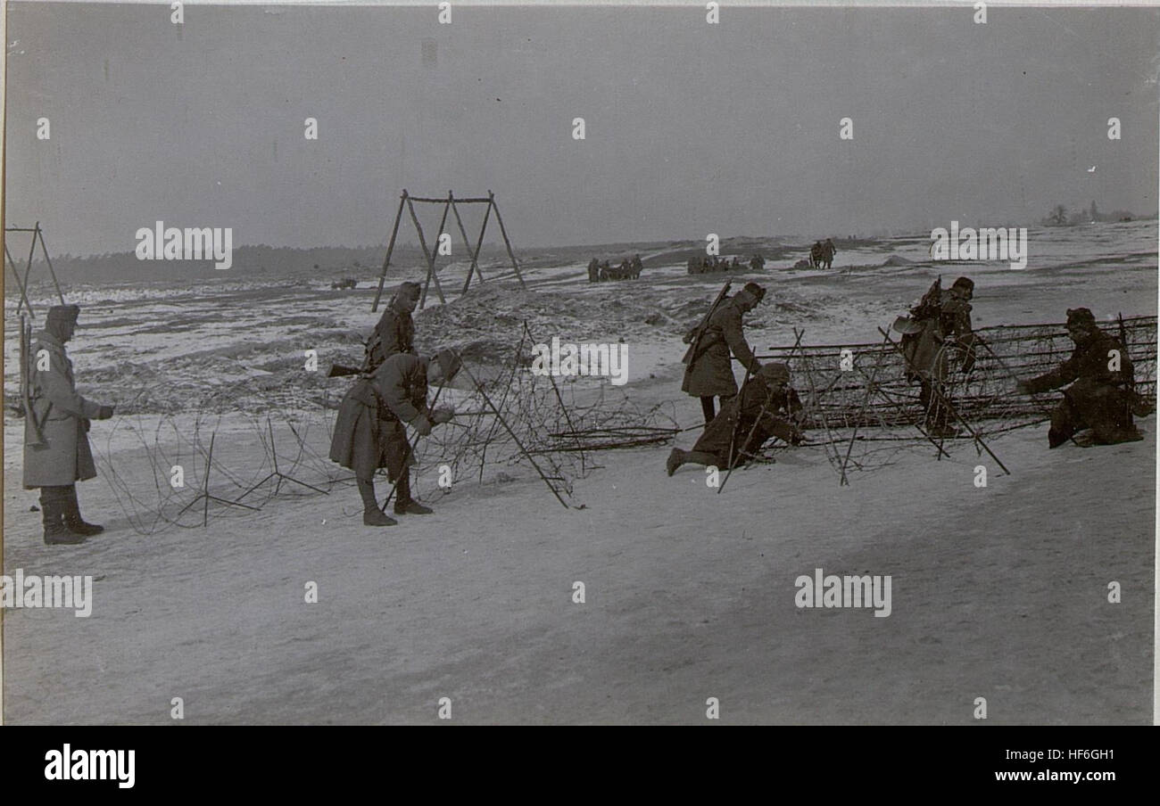 A World War I photograph depicting the setup of obstacles during a ...