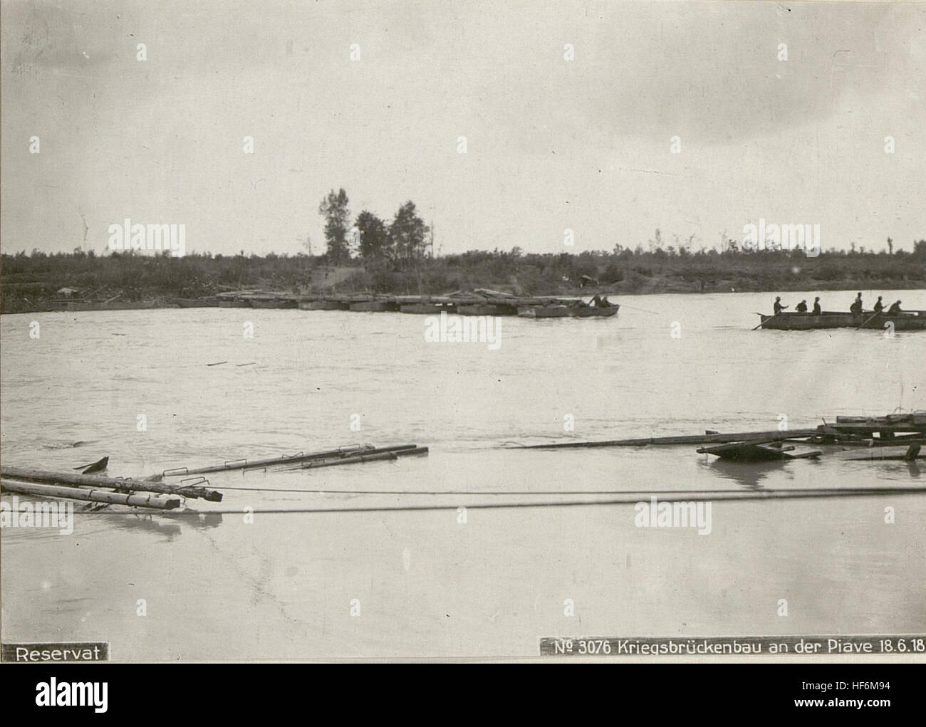 A photograph marked as 'Reserved' showing war bridge construction on ...