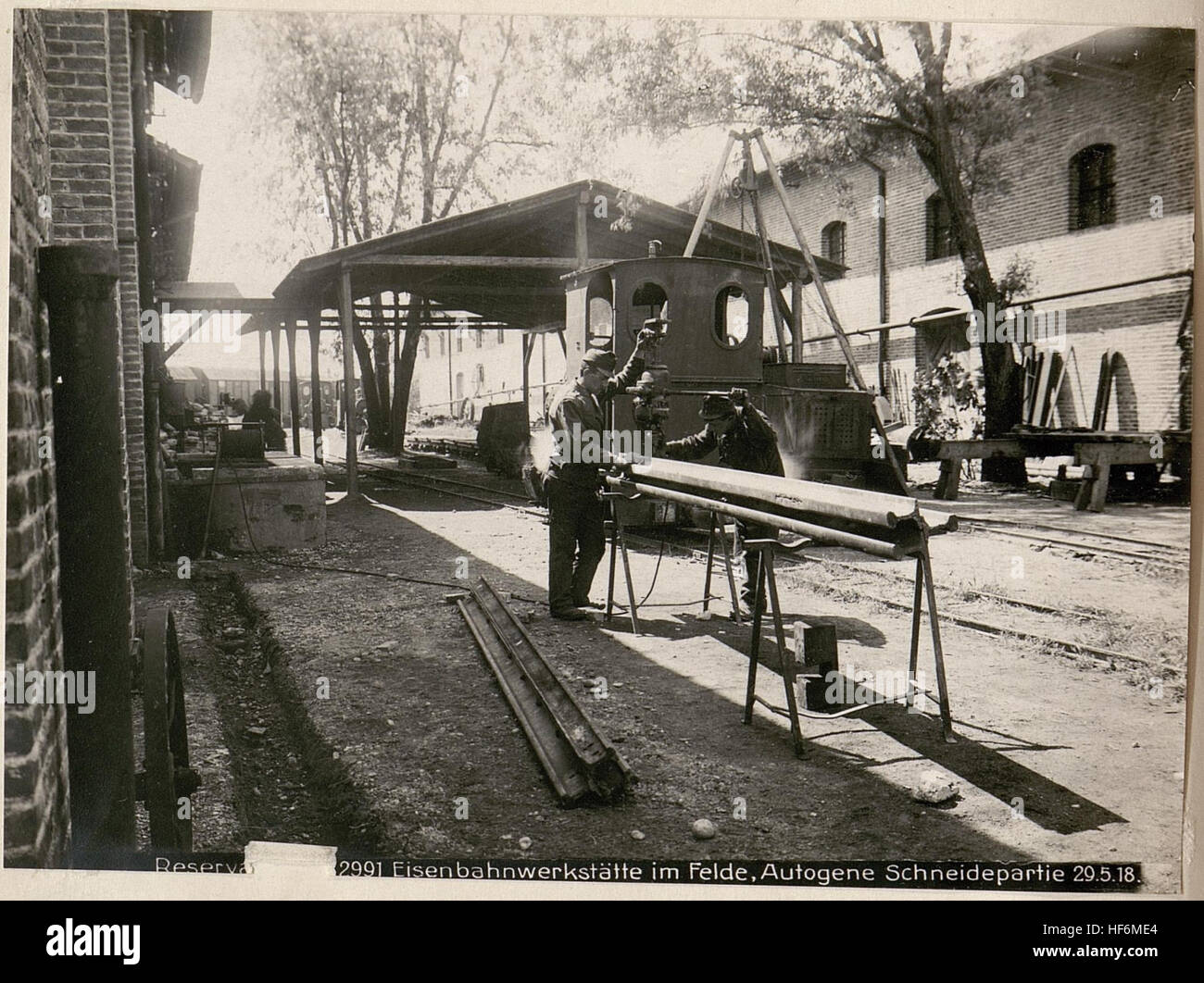 A photograph of a railway workshop in the field with an autogenous ...