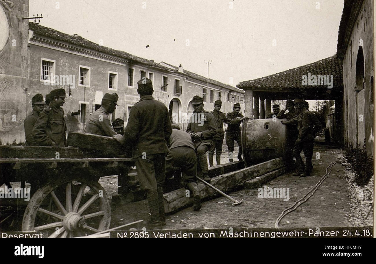 A restricted image showing the loading of machine gun turret domes on ...