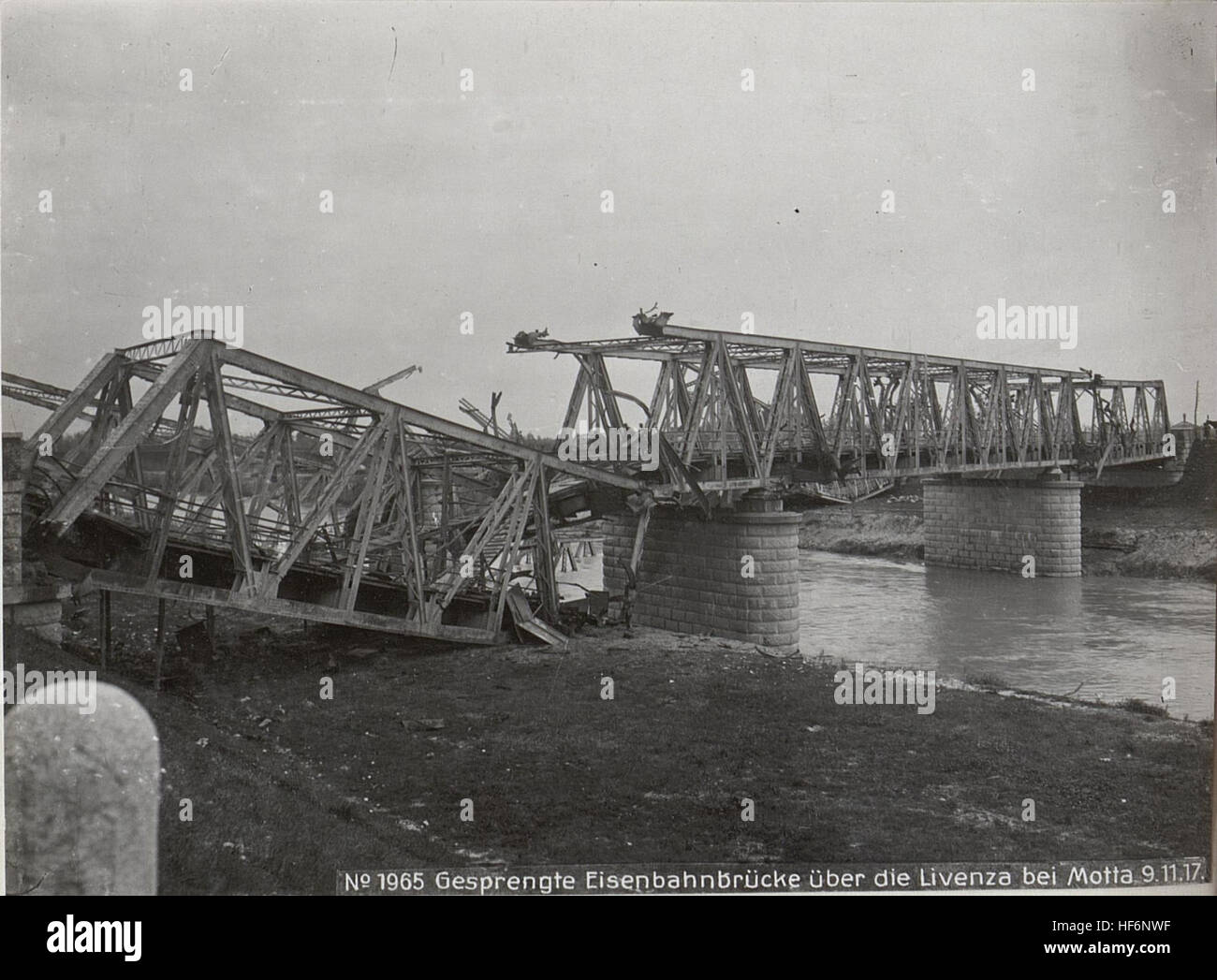 A photograph of a destroyed railway bridge over the Livenza River at ...