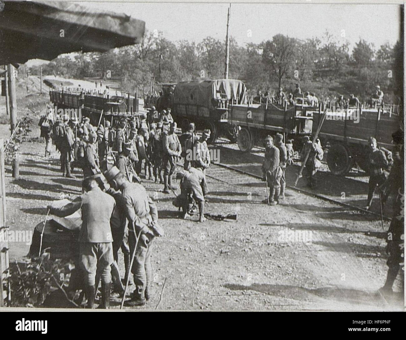 A historical photograph showing a troop transport using field railway ...