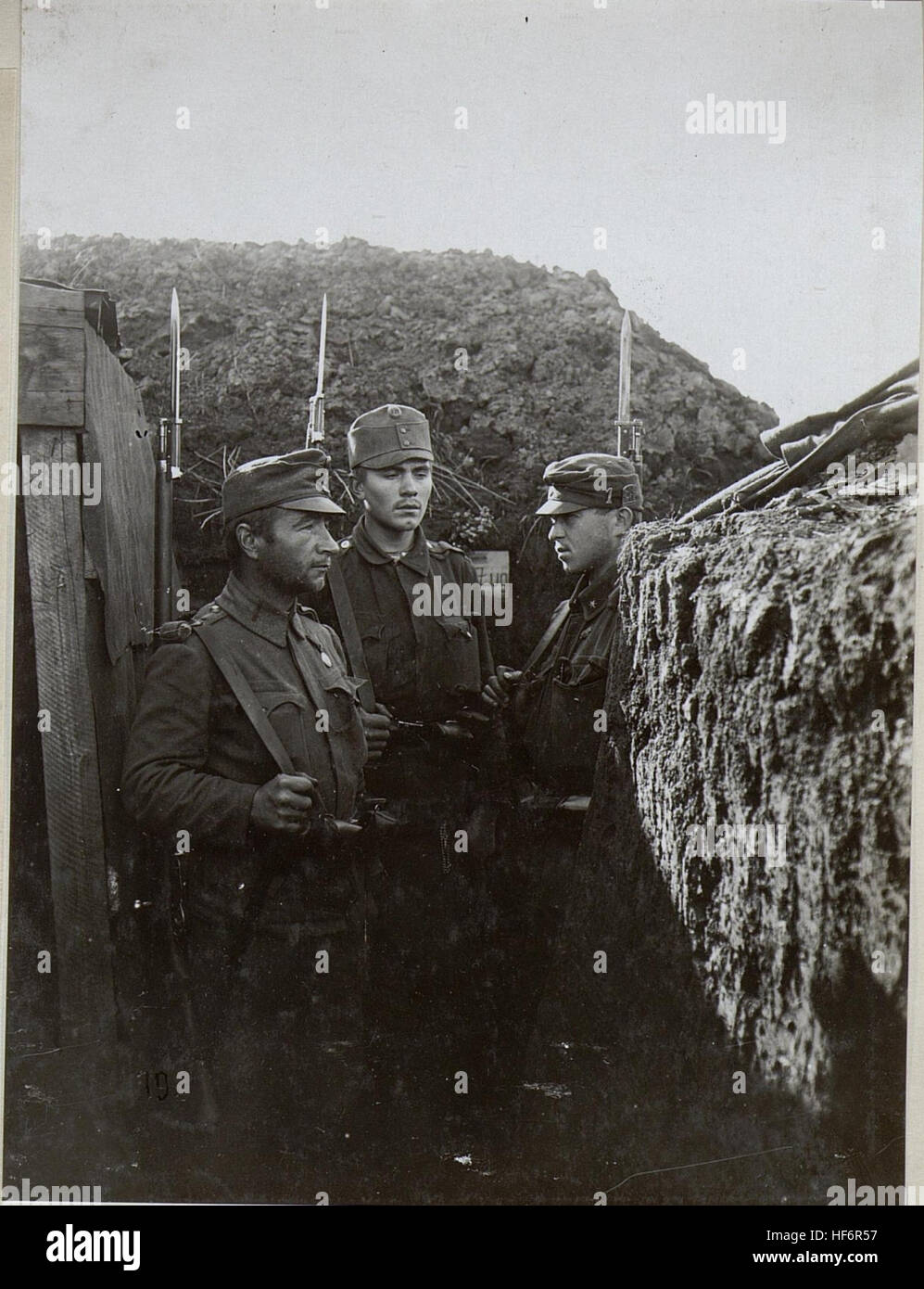 Soldiers relieve sentry duty in a World War I trench, depicted in a ...