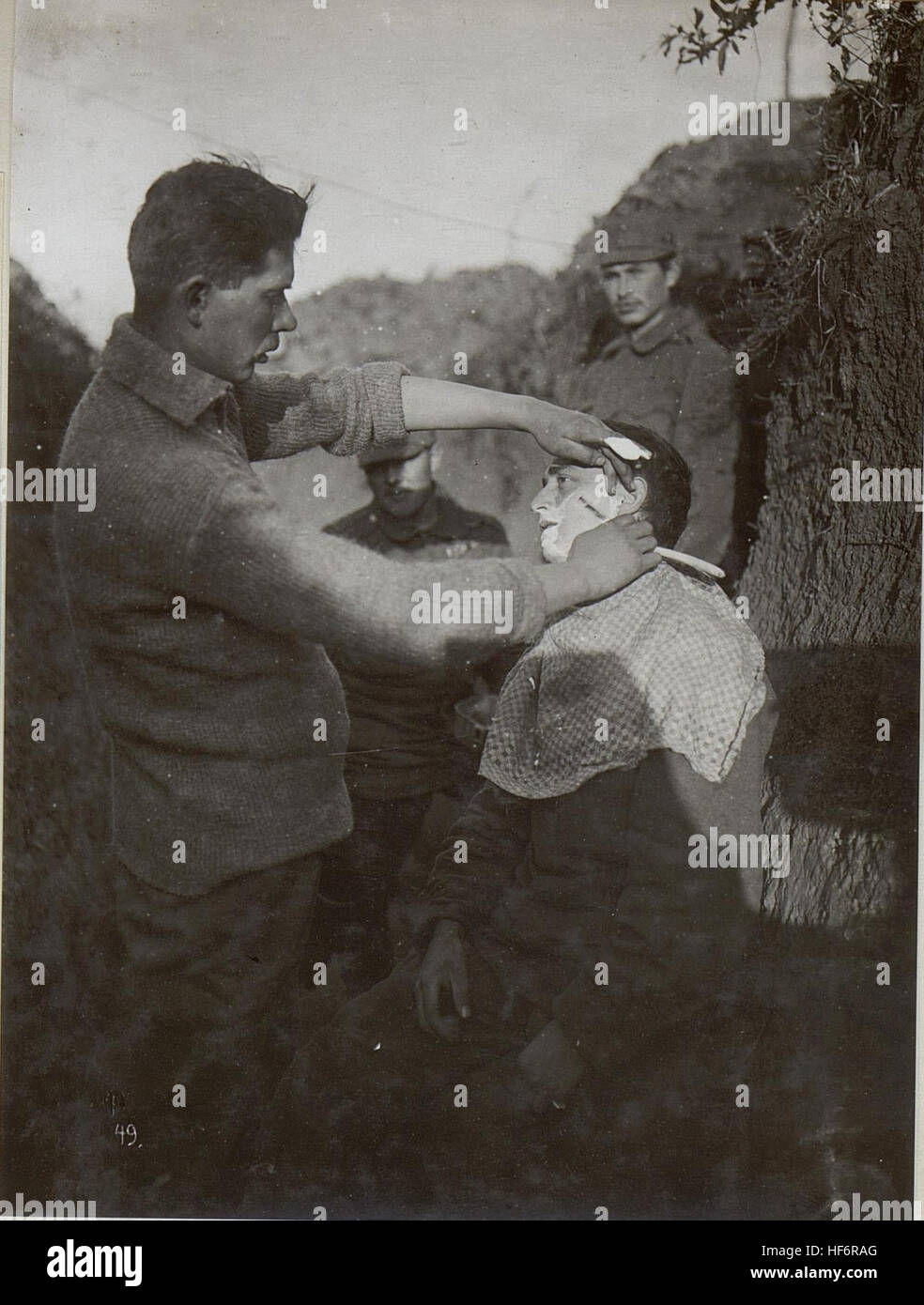 Soldier shaving in a WWI trench, showcasing the daily life and routines ...