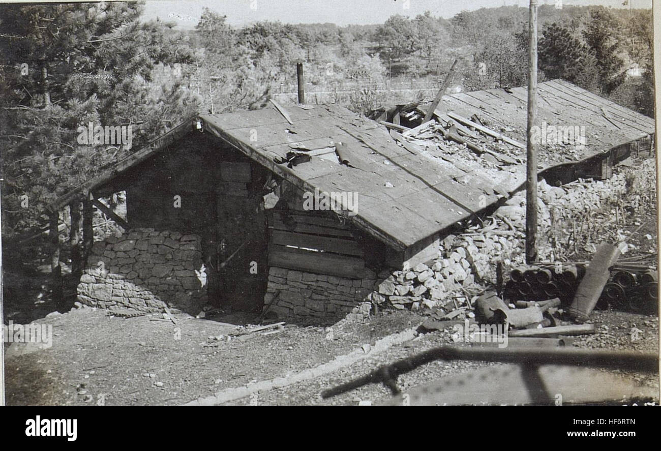 A World War I battlefield photograph showing a direct hit on a material ...