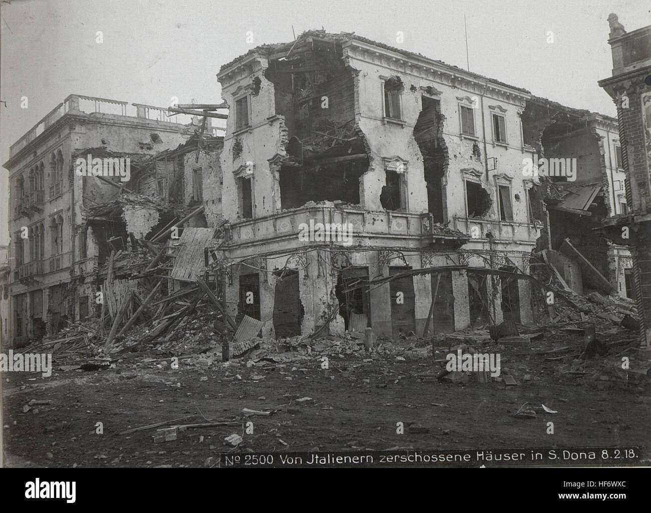 Ruined buildings at the street corner in Sandona, World War I ...