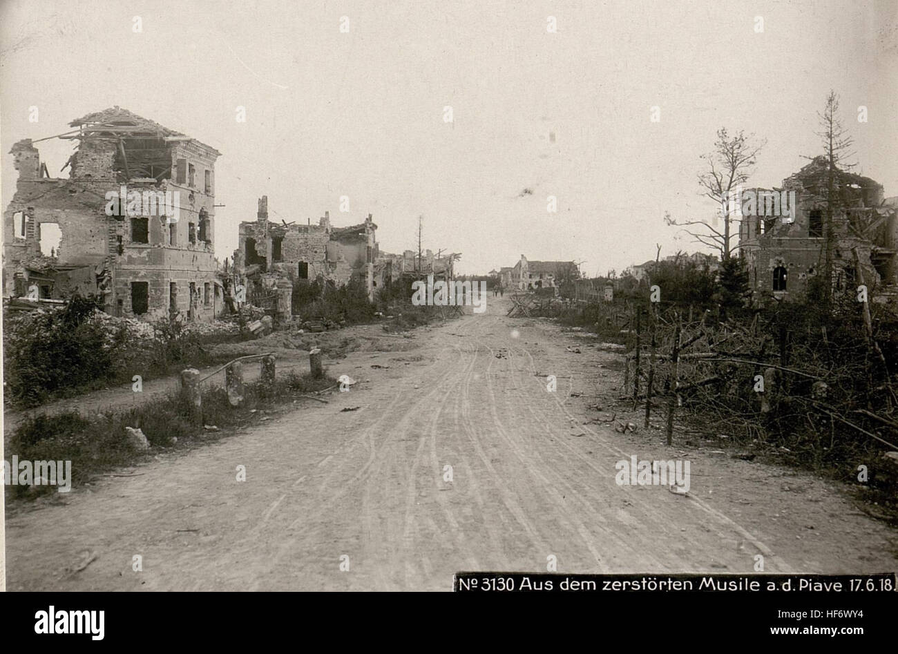 A photograph showing military vehicles or soldiers on a road during ...