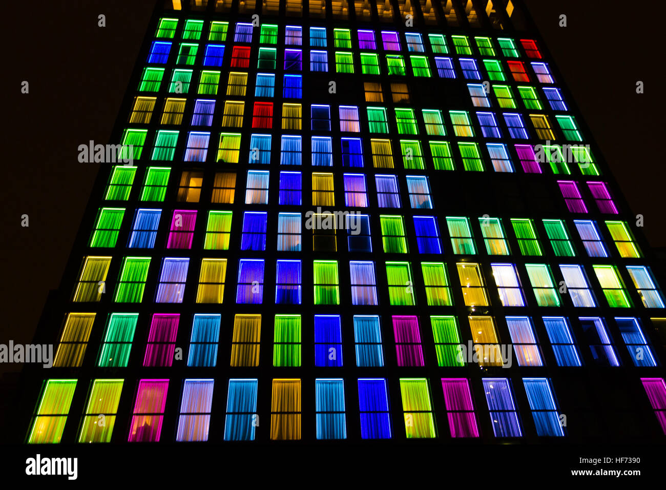 Colored windows texture. Windows illuminated by neon lights background ...