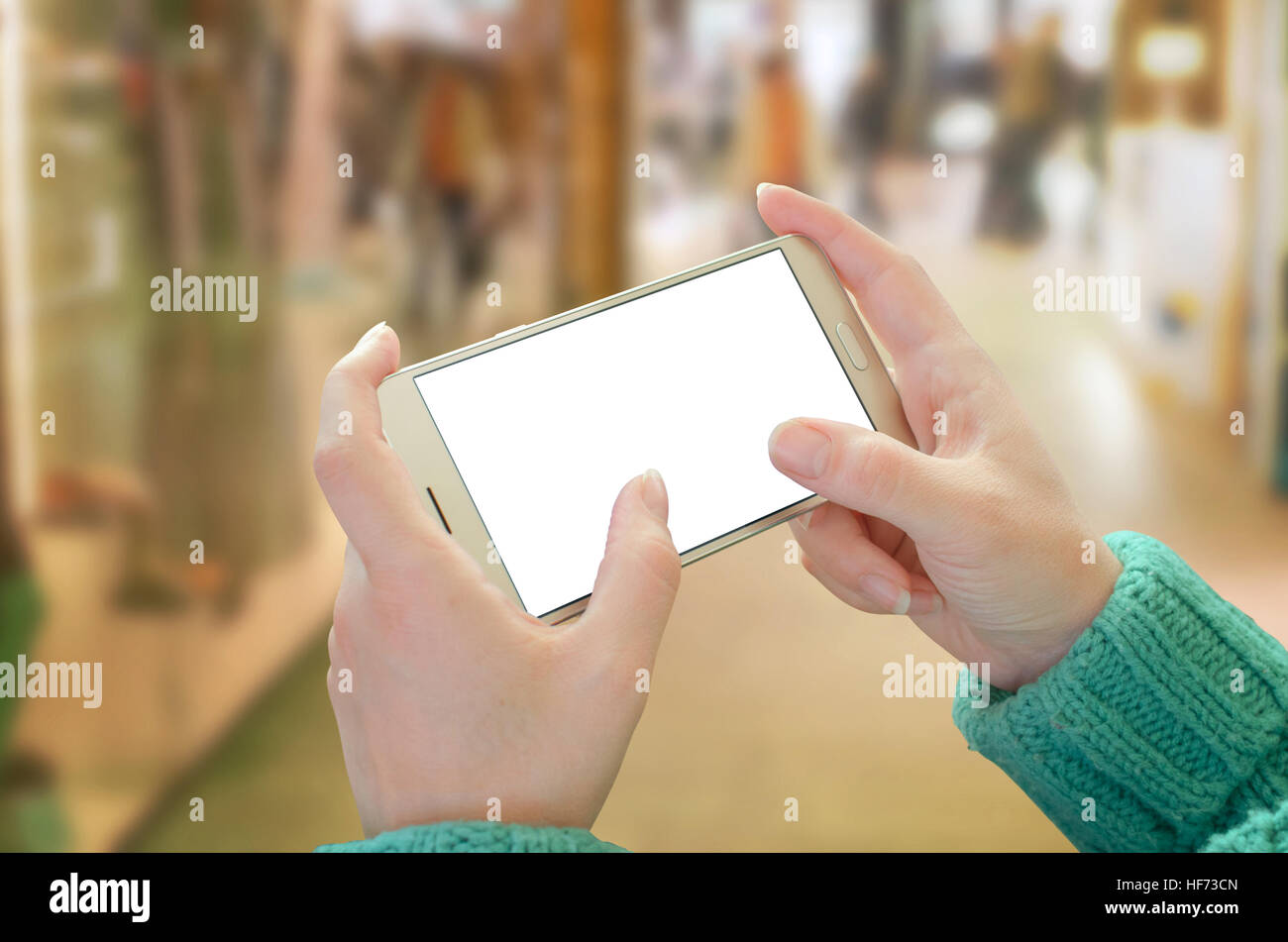 Playing game on smartphone. Woman holding mobile in horizontal position ...