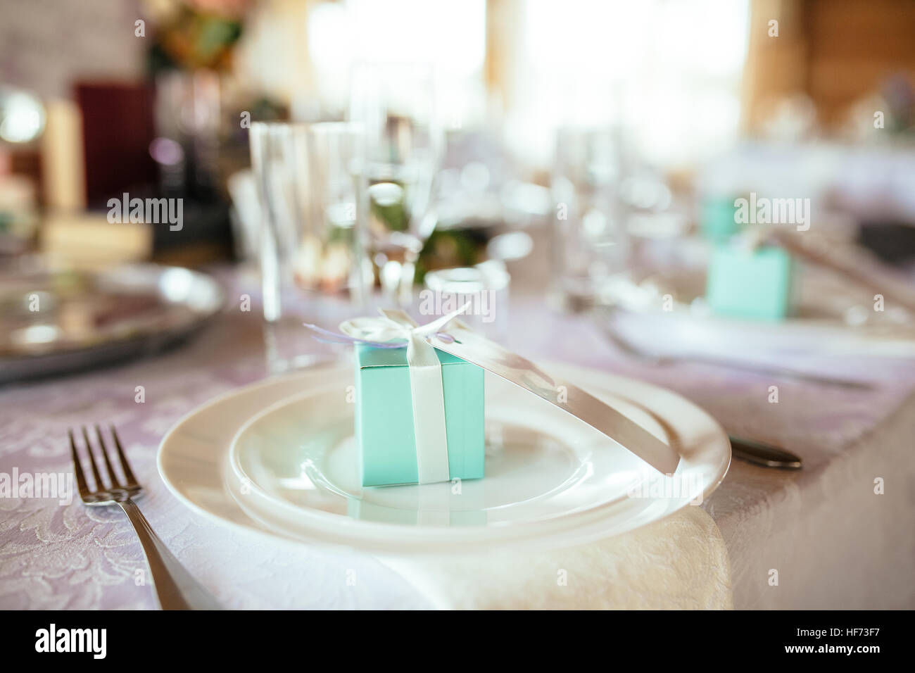 Table served with cutlery. on a plate and gift guest nameplate Stock ...