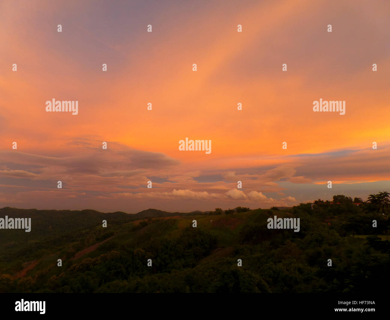 Stunning Orange and Purple of Sunset Afterglow over the Mountain Range ...