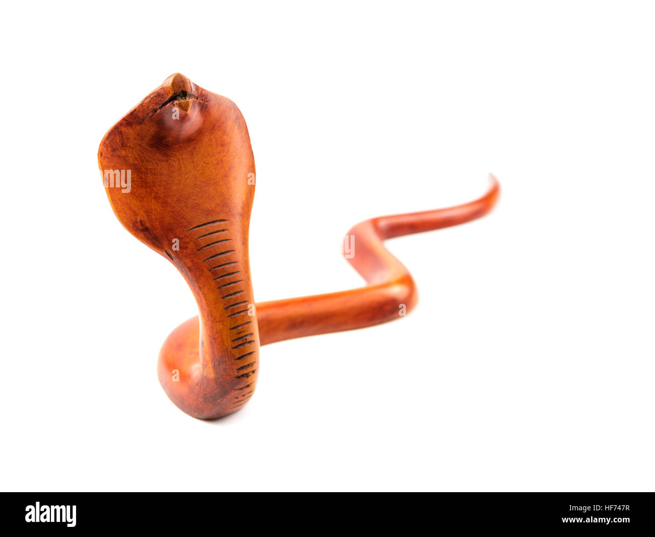 wooden cobra snake on white background Stock Photo - Alamy