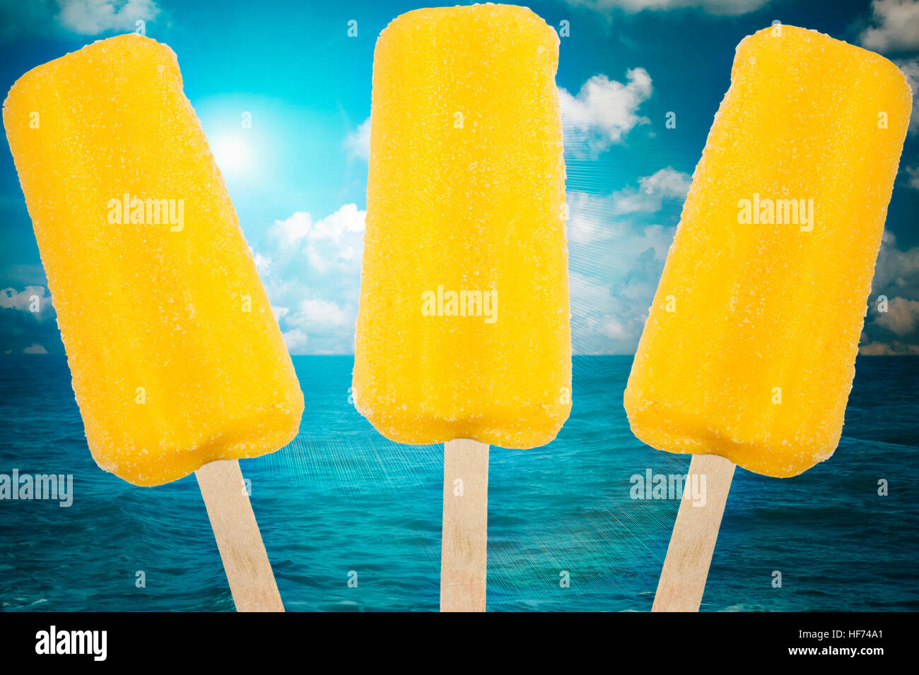 Yellow Ice cream on summer sea background Stock Photo - Alamy