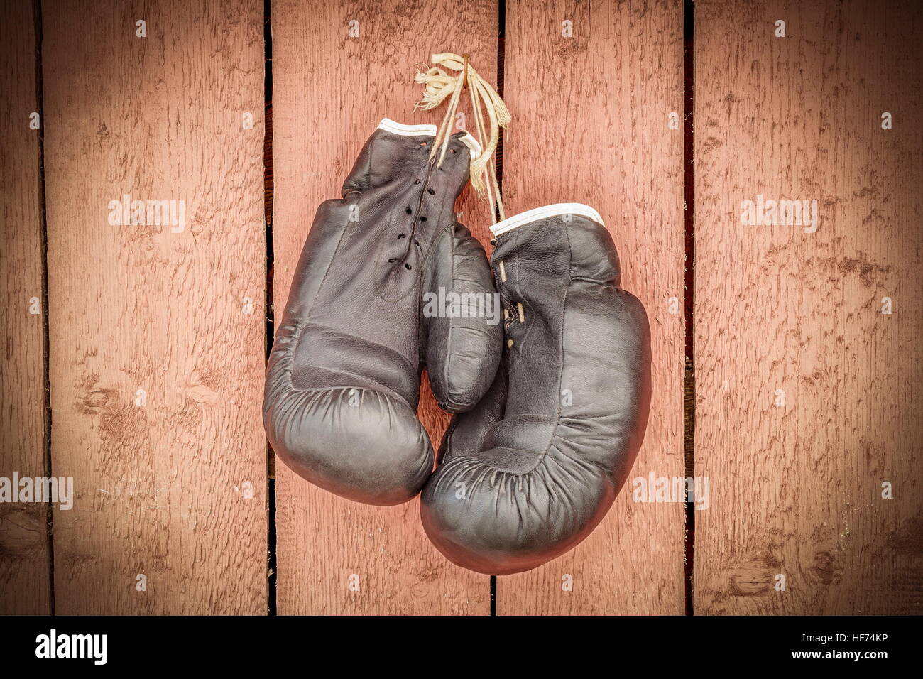 Old boxing gloves on wooden wall Stock Photo - Alamy