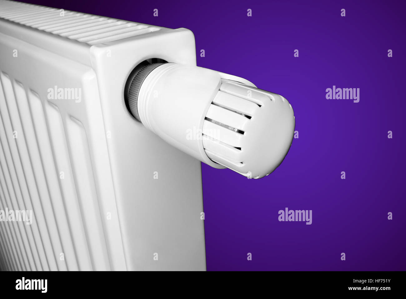 Radiator with thermostat valve isolated on violet gradient Stock Photo ...