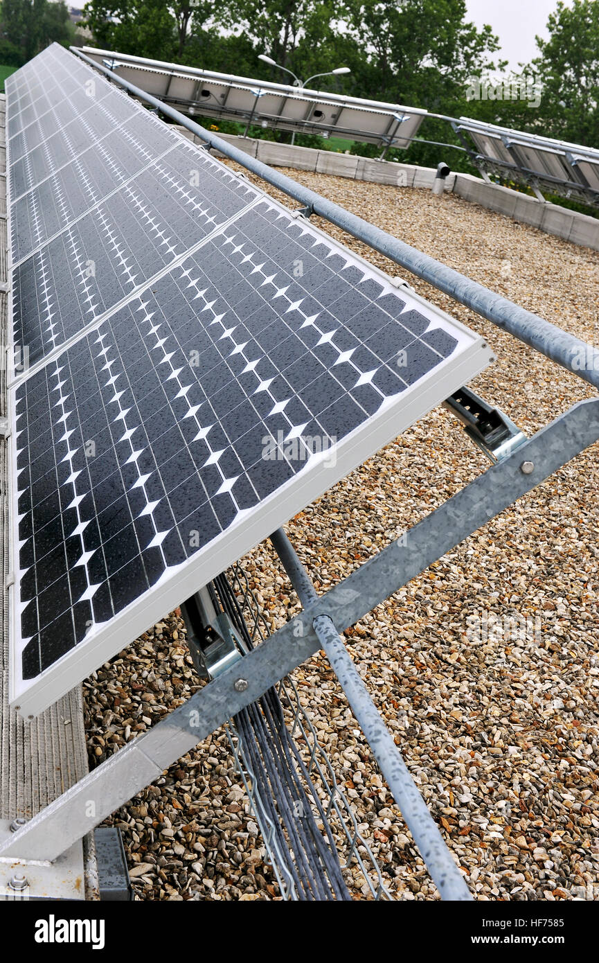 Solar panels on a roof of an office building Stock Photo - Alamy