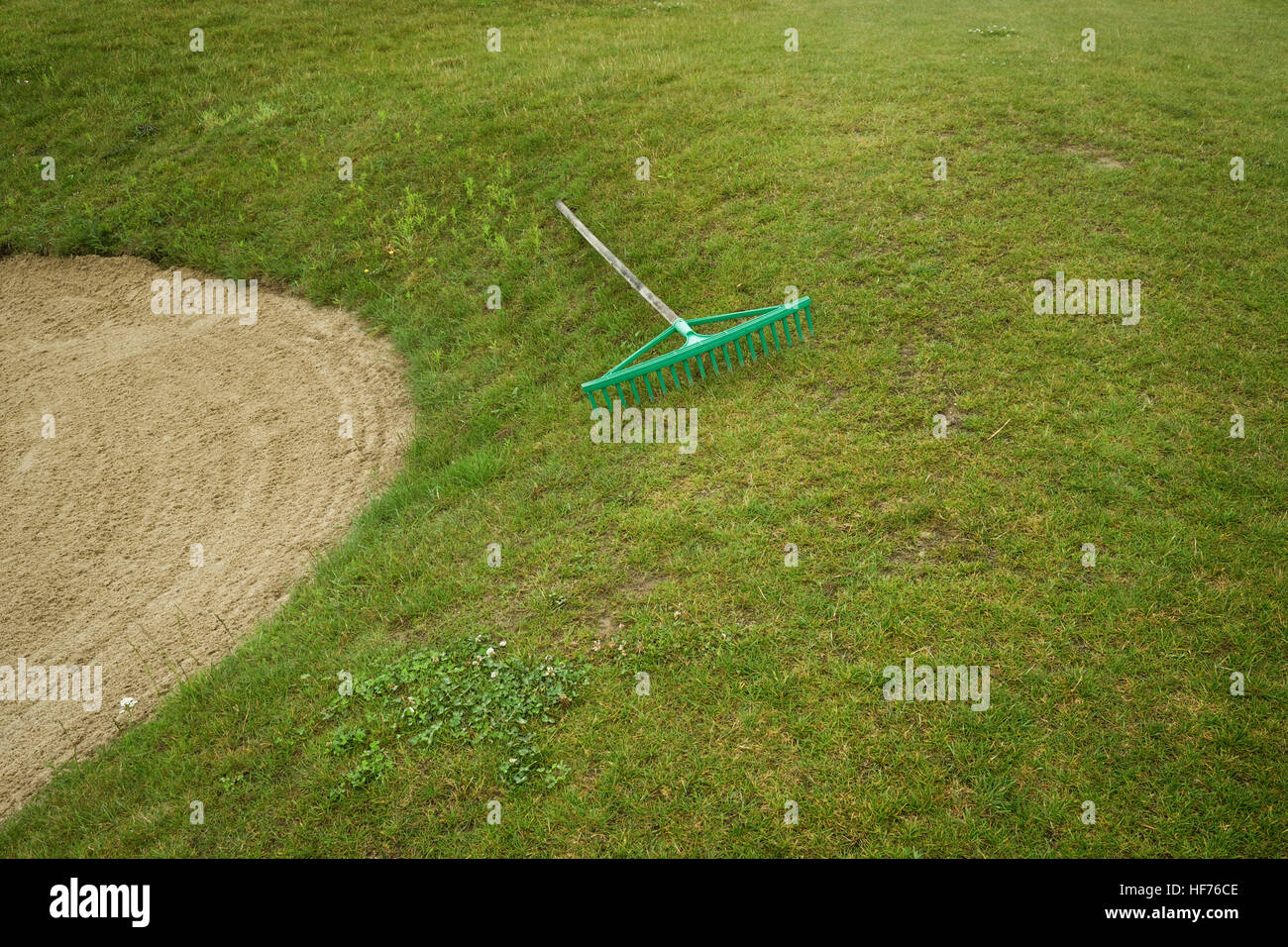Sand Trap and rake At Golf Course Stock Photo - Alamy