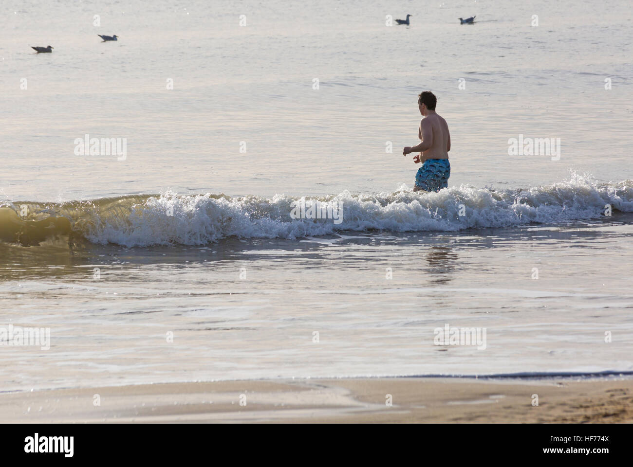 Swimmer in the sea at Bournemouth beach on a lovely sunny day on Boxing ...