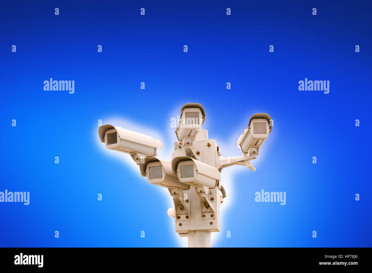 Multiple surveillance cameras on blue sky Stock Photo - Alamy