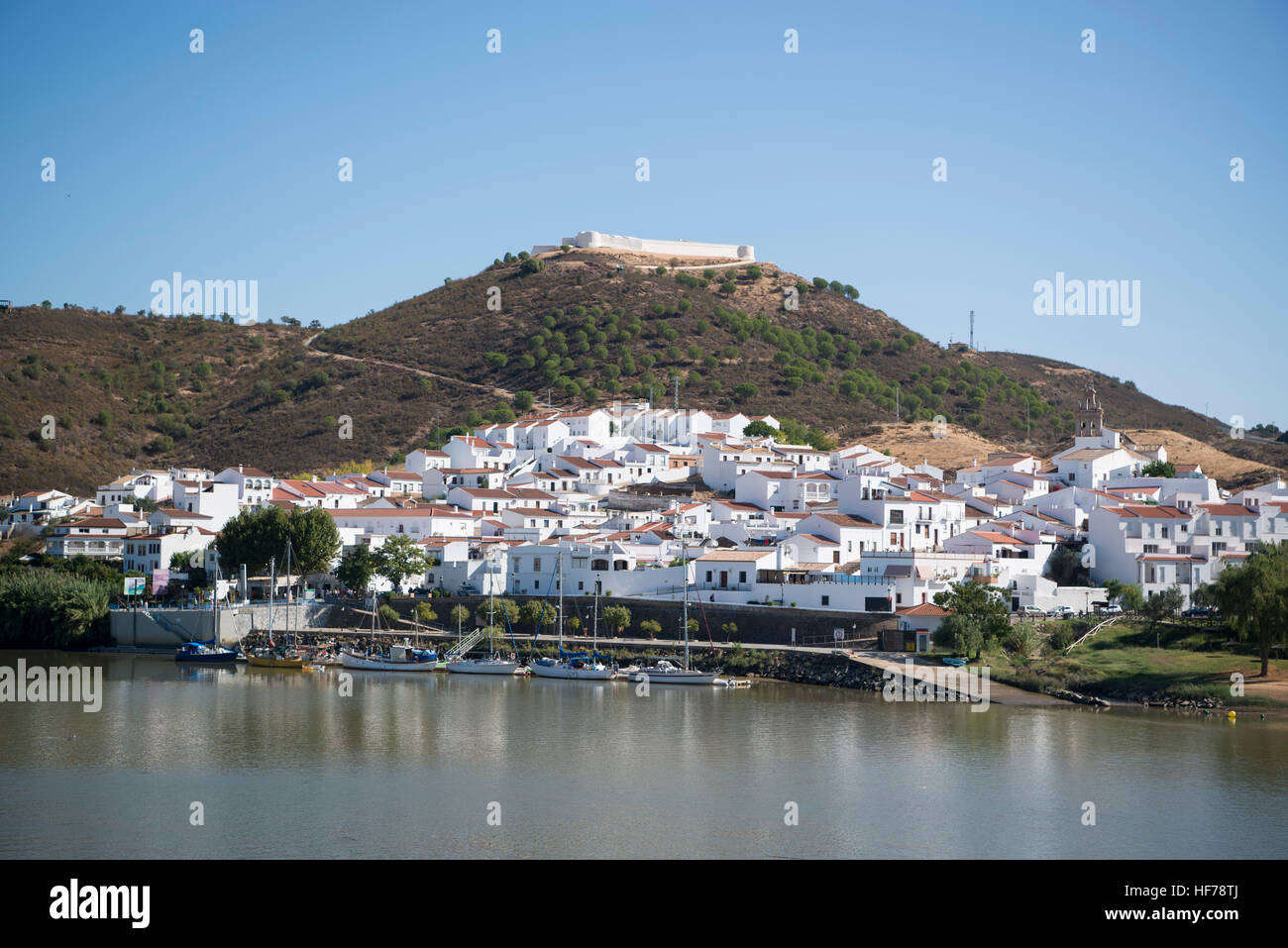 town Sanlucar de Guadiana in Spain at the river Rio Guadiana on the ...