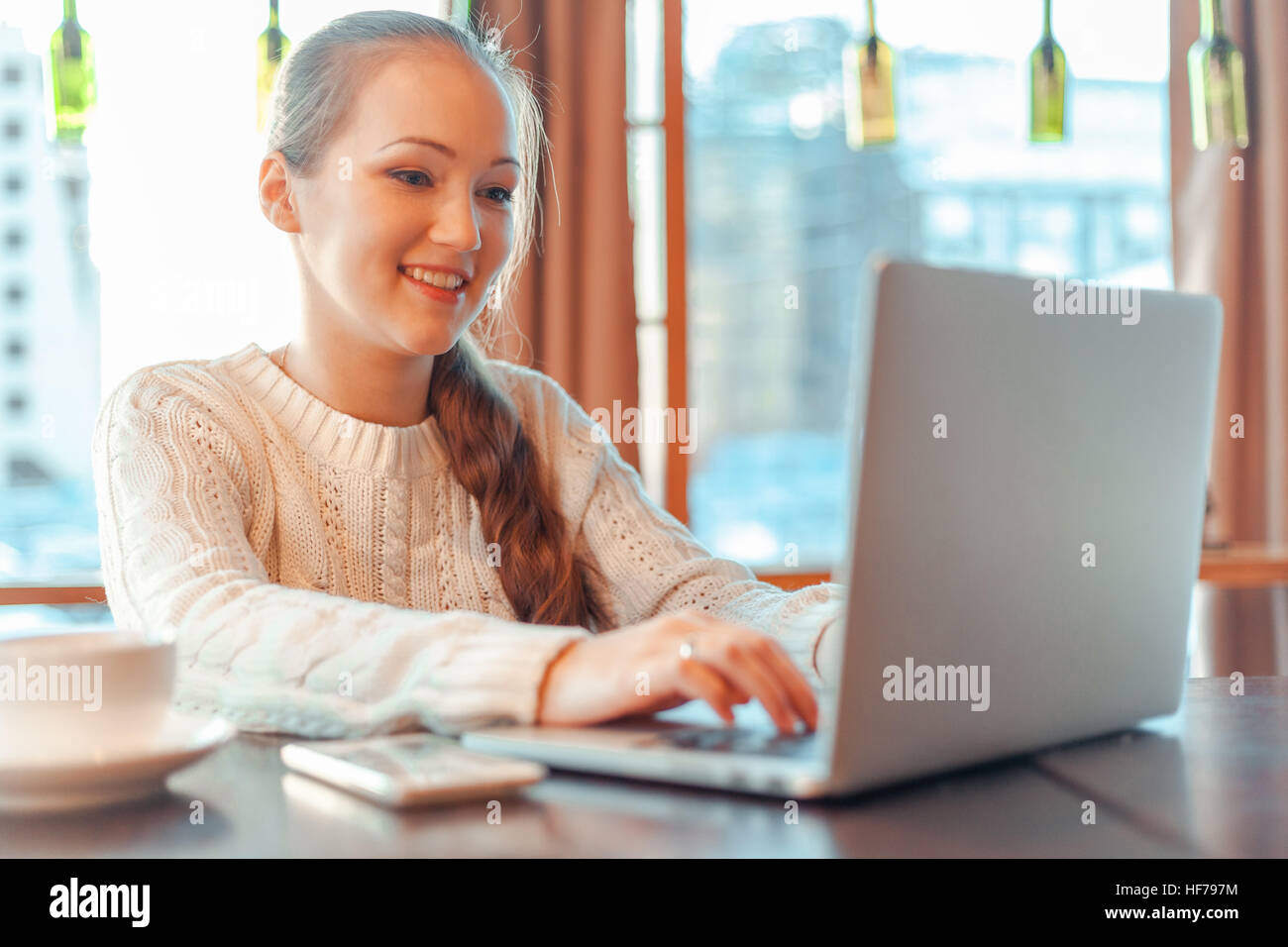 Woman working on laptop Stock Photo - Alamy
